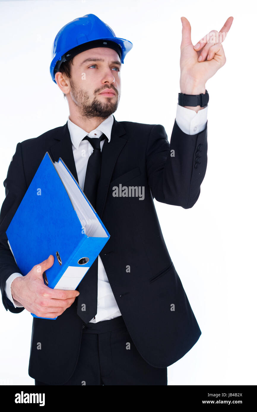 Young architect or structural engineer in a hardhat and suit working on ...