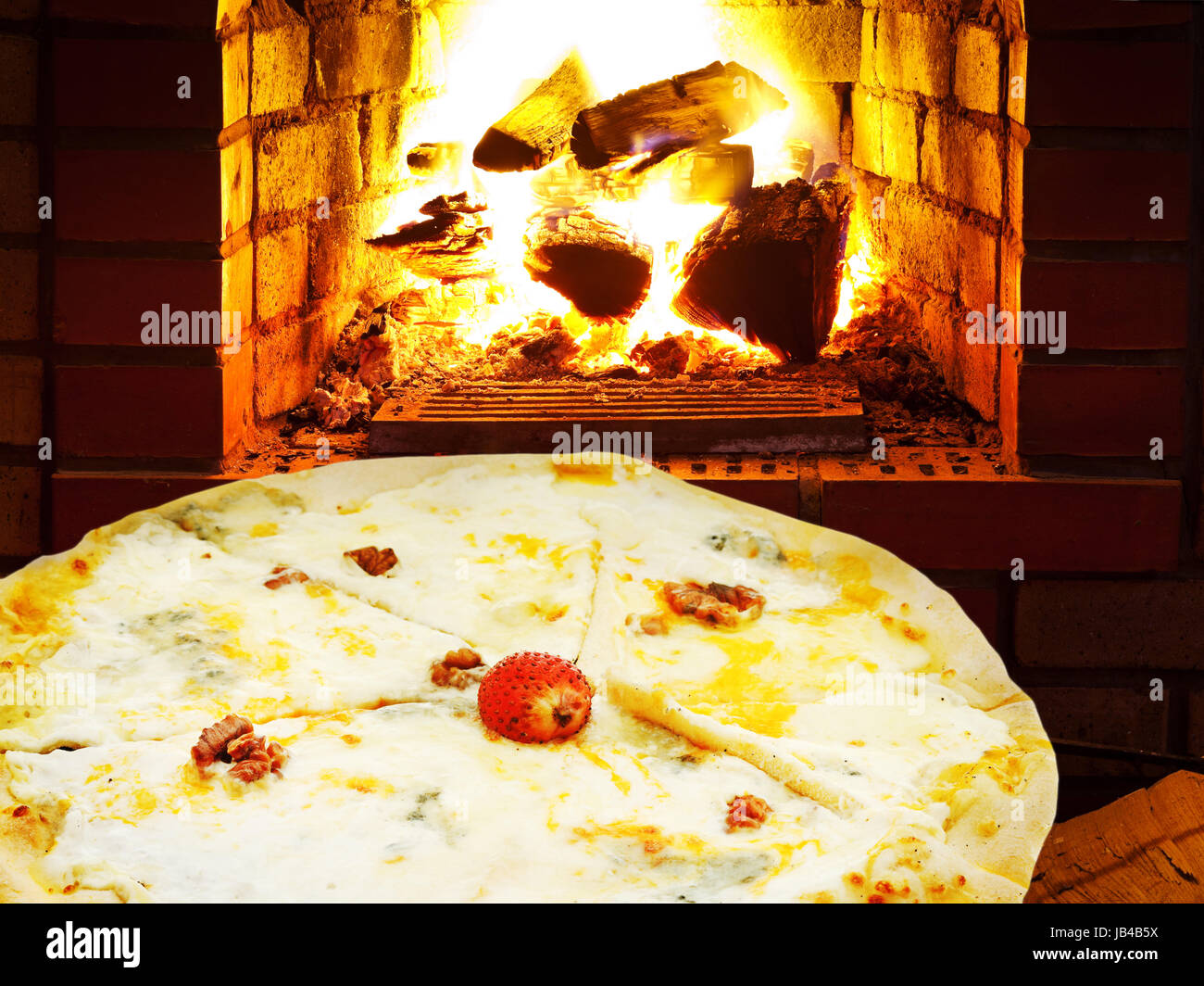 italian pizza quatro formaggi and open fire in wood burning oven Stock ...