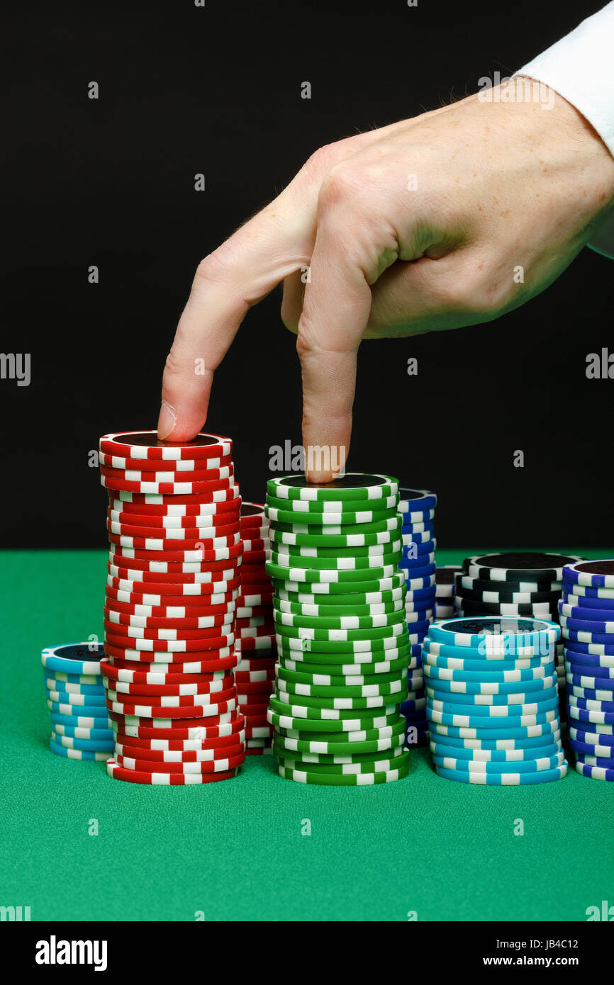 Hand walks on a pile of chips Stock Photo - Alamy