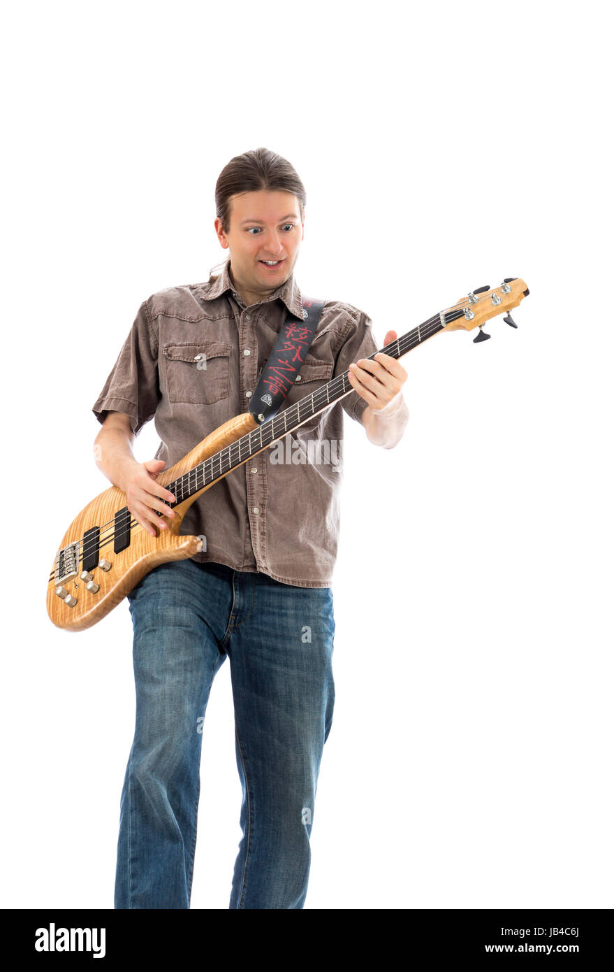Bass guitarist with a funny look playing his bass guitar (Series with ...