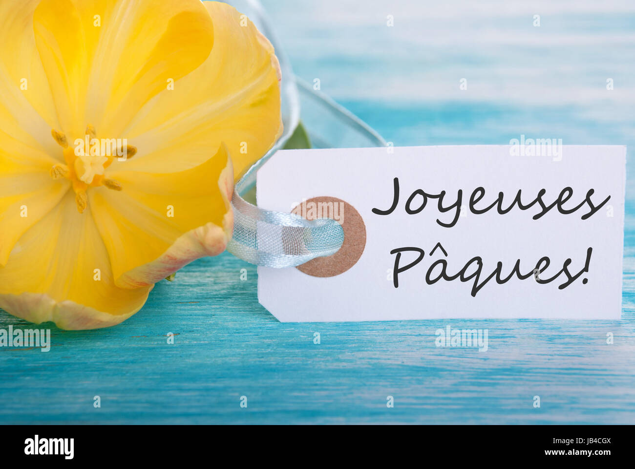 Background with Label with the French Words Joyeuses Paques which means ...