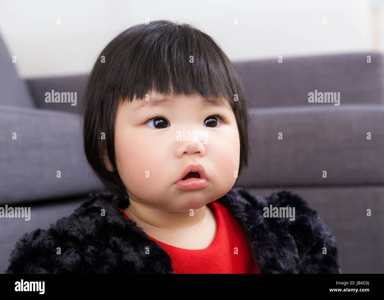 Baby girl feel curiosity at home Stock Photo - Alamy