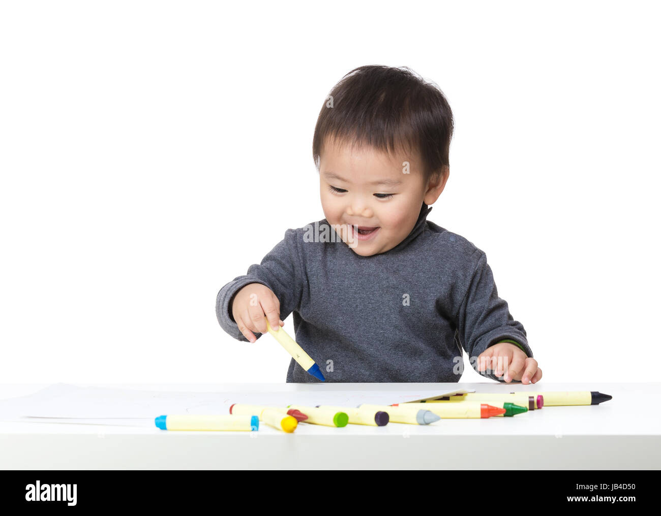 Little boy concentrate on drawing Stock Photo - Alamy