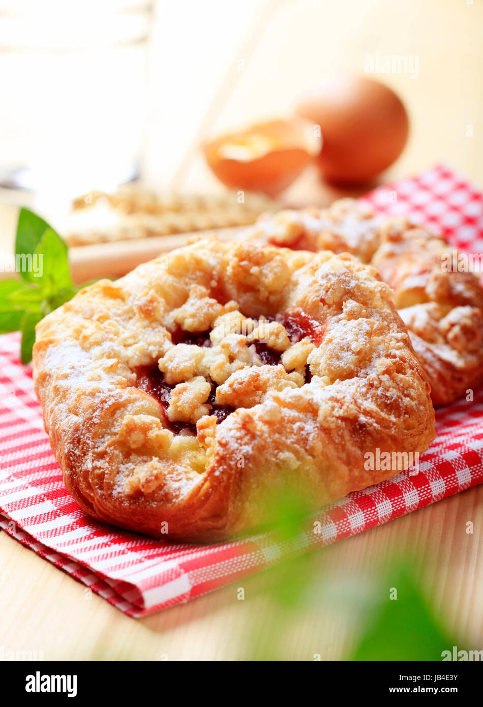 Danish pastry with jam and crumb topping Stock Photo - Alamy
