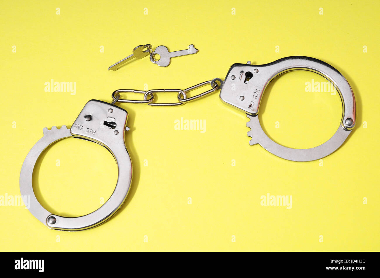 Handcuffing prison hi-res stock photography and images - Alamy