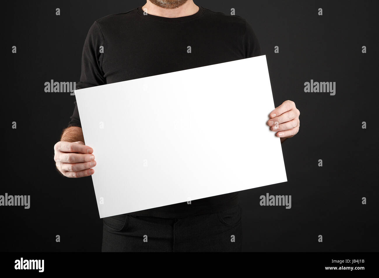 man holding poster Stock Photo - Alamy