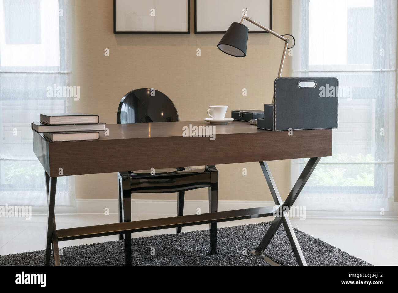 wooden table and books in modern working room interior Stock Photo - Alamy