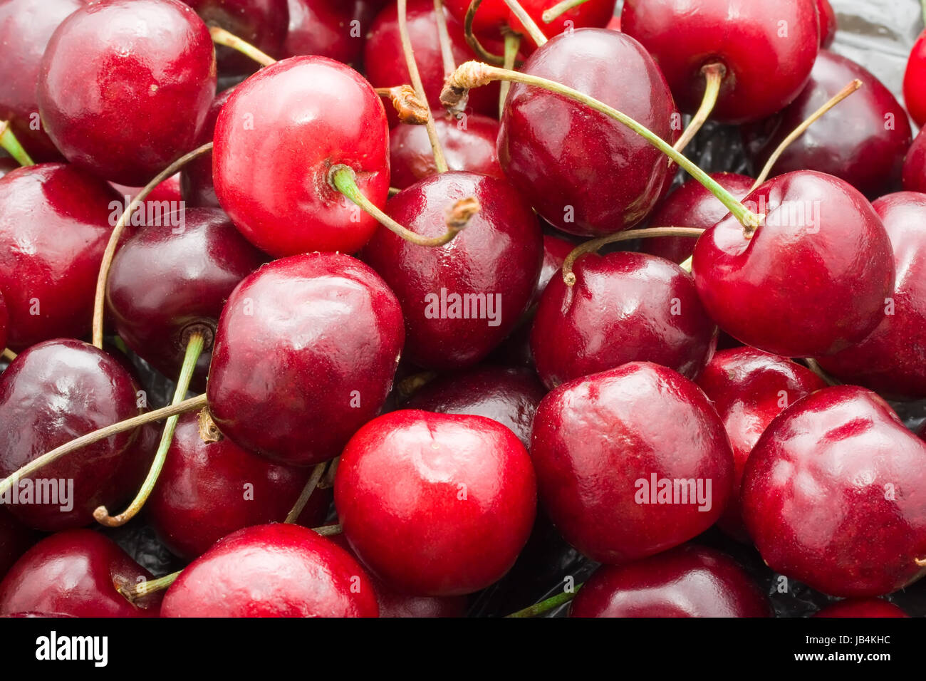 Beautiful red fresh cherry macro photo background Stock Photo - Alamy