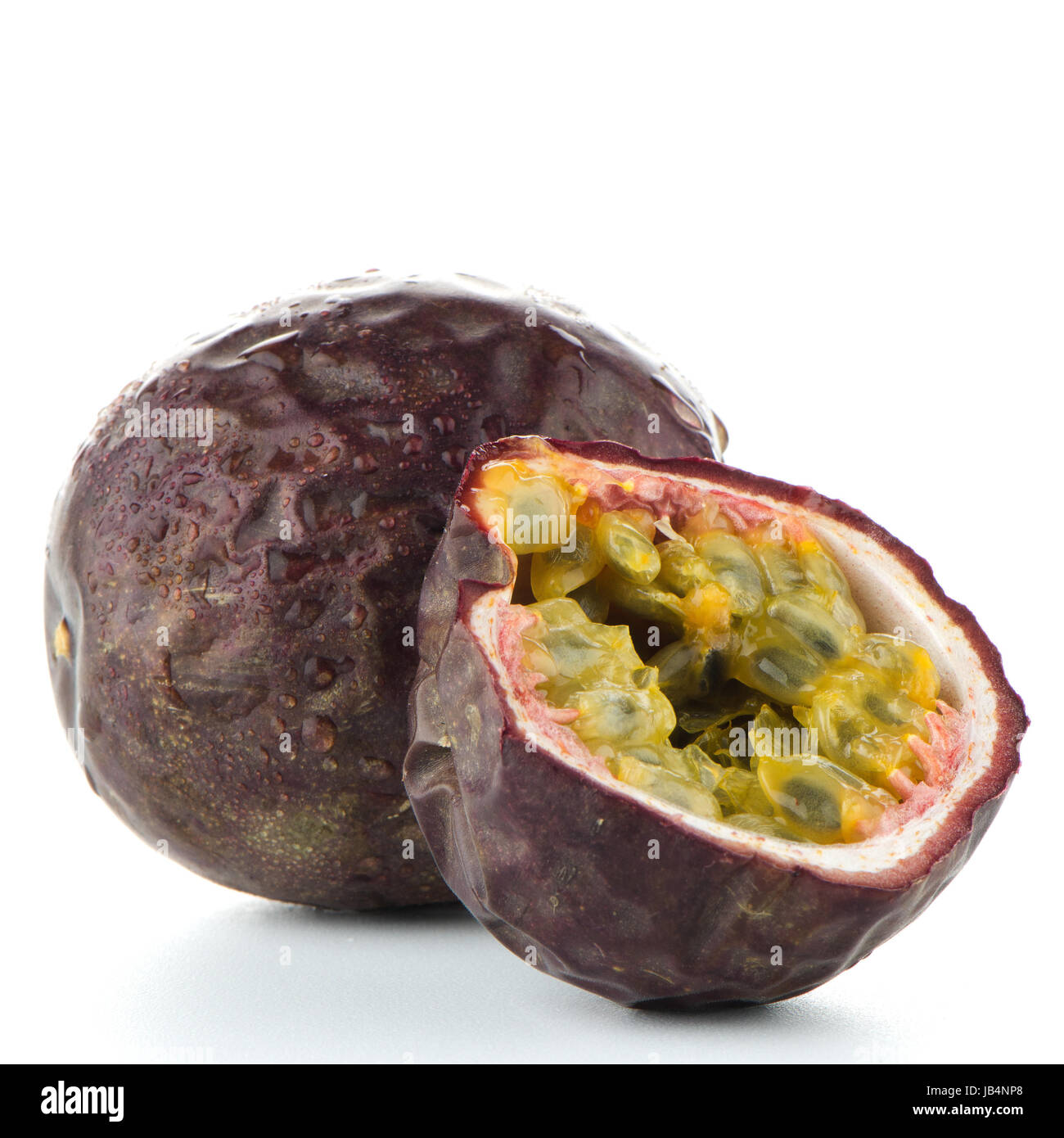 Ripe passion fruit isolated on white background Stock Photo - Alamy