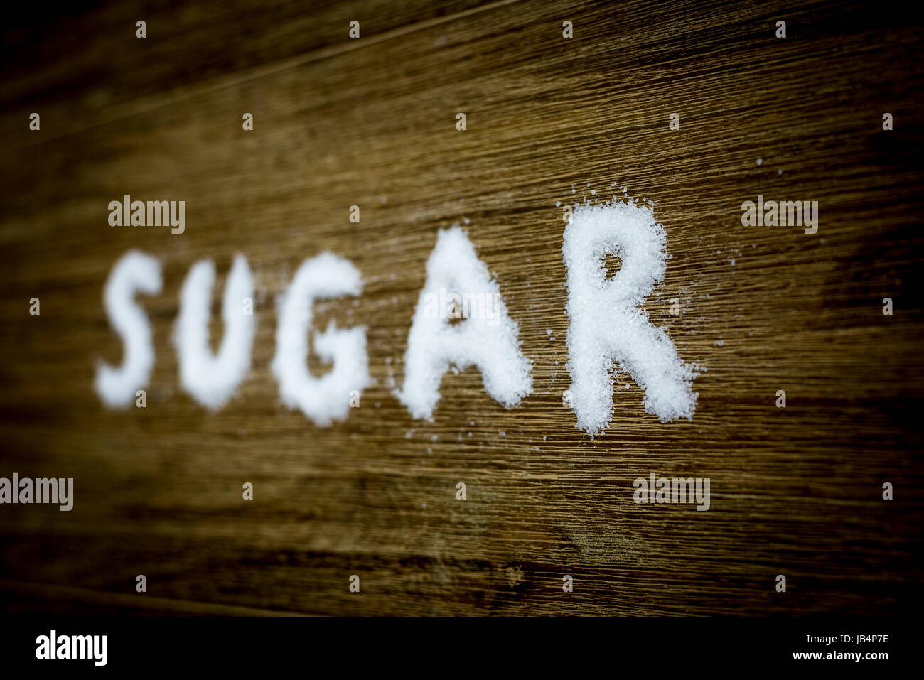 sugar text written with sugar crystals on table Stock Photo - Alamy