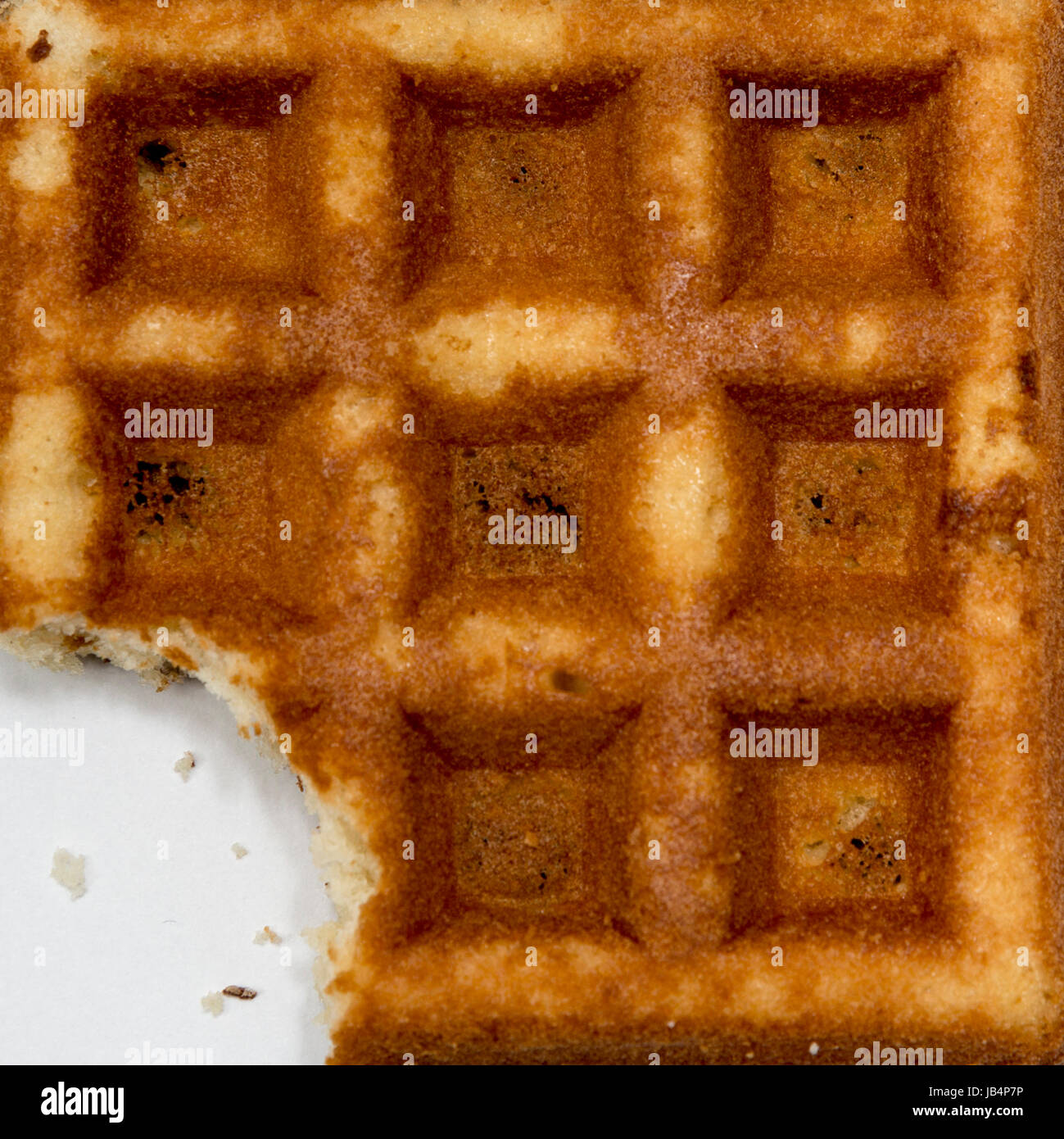 full frame waffle with one corner bitten of Stock Photo - Alamy