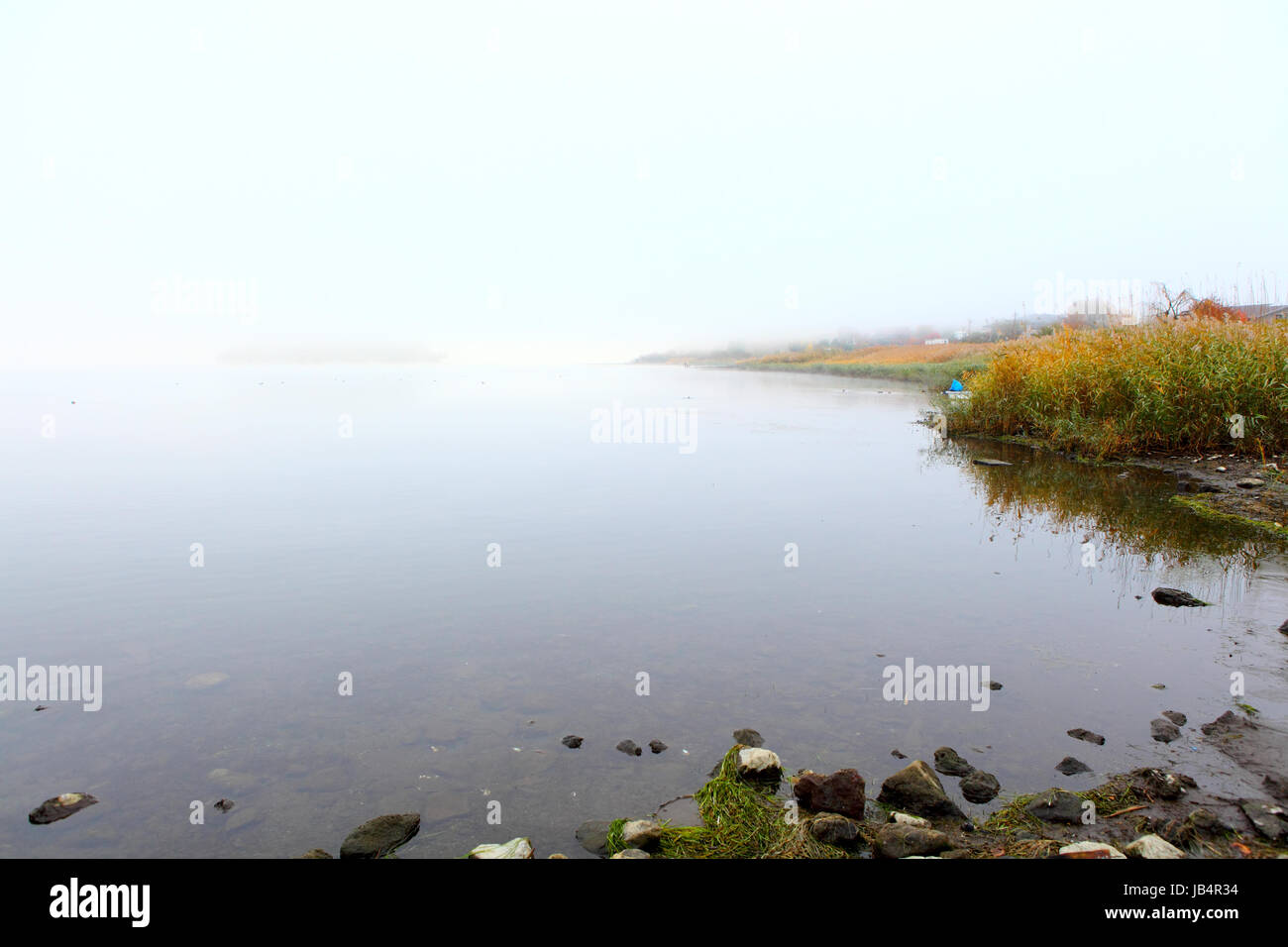 Lake with smog at morning Stock Photo - Alamy