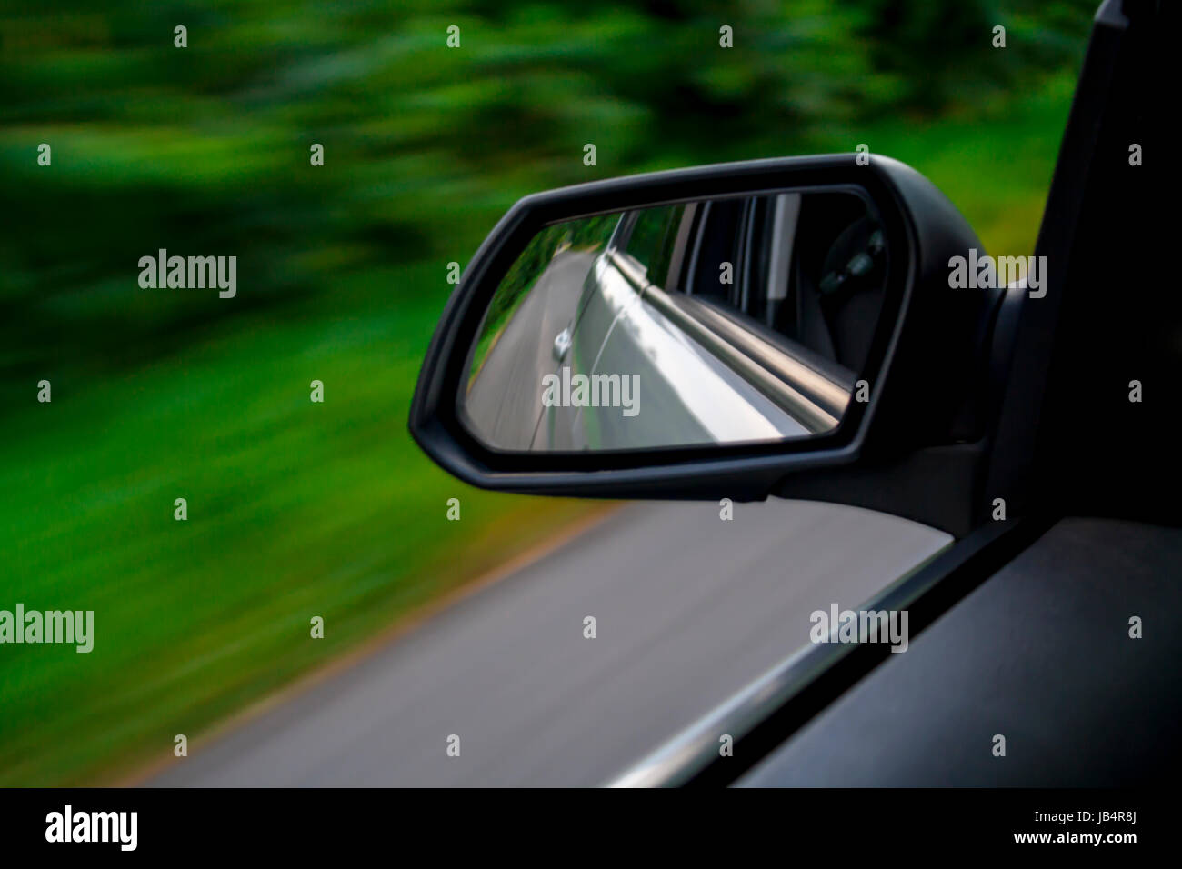 rear view mirror of driving car Stock Photo - Alamy