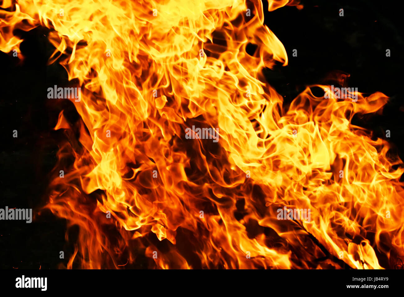 Beautiful yellow and orange hot fire on black background Stock Photo ...