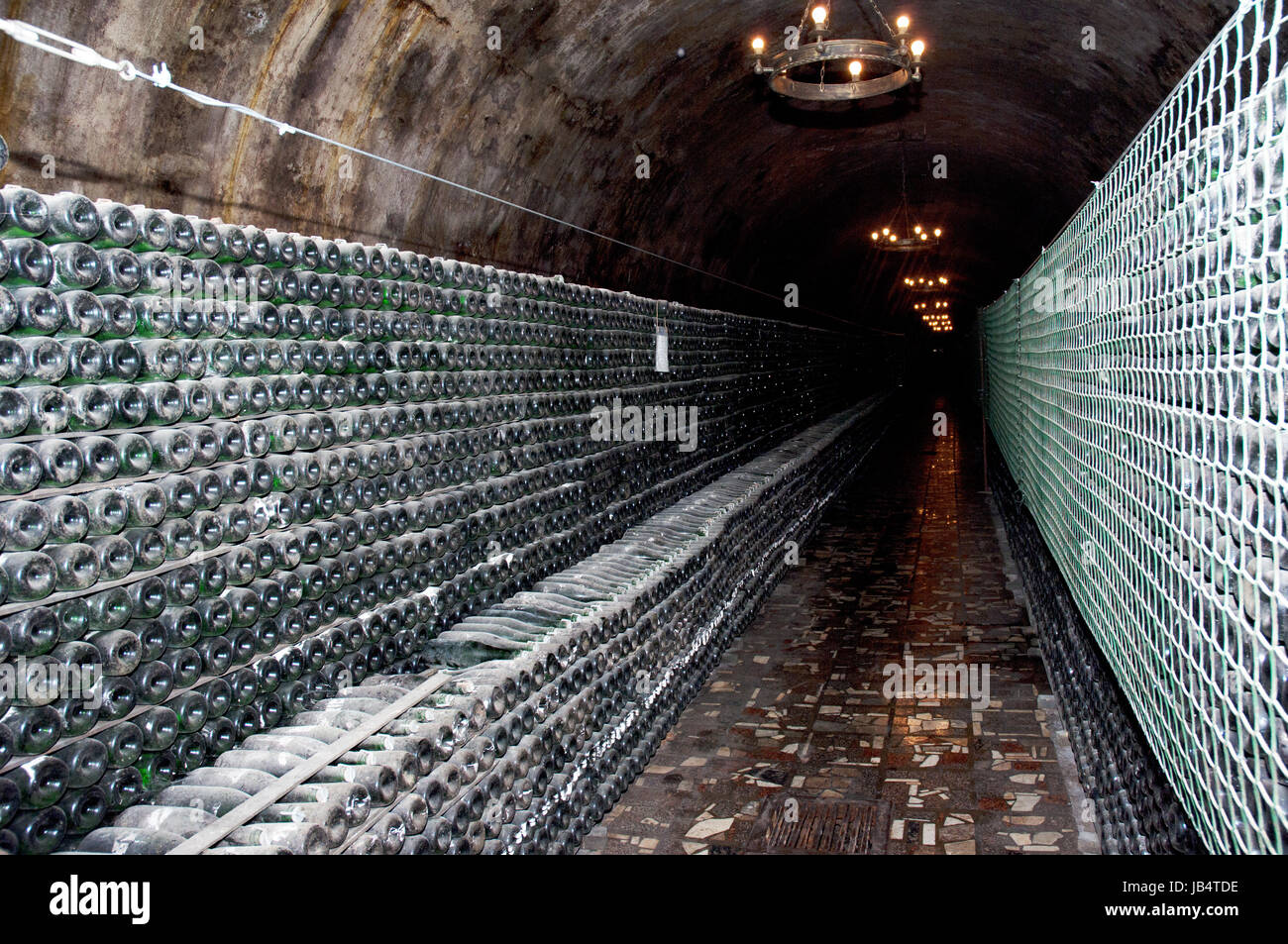 Stack of wine bottles in winery. Shampagne wine storage Stock Photo - Alamy