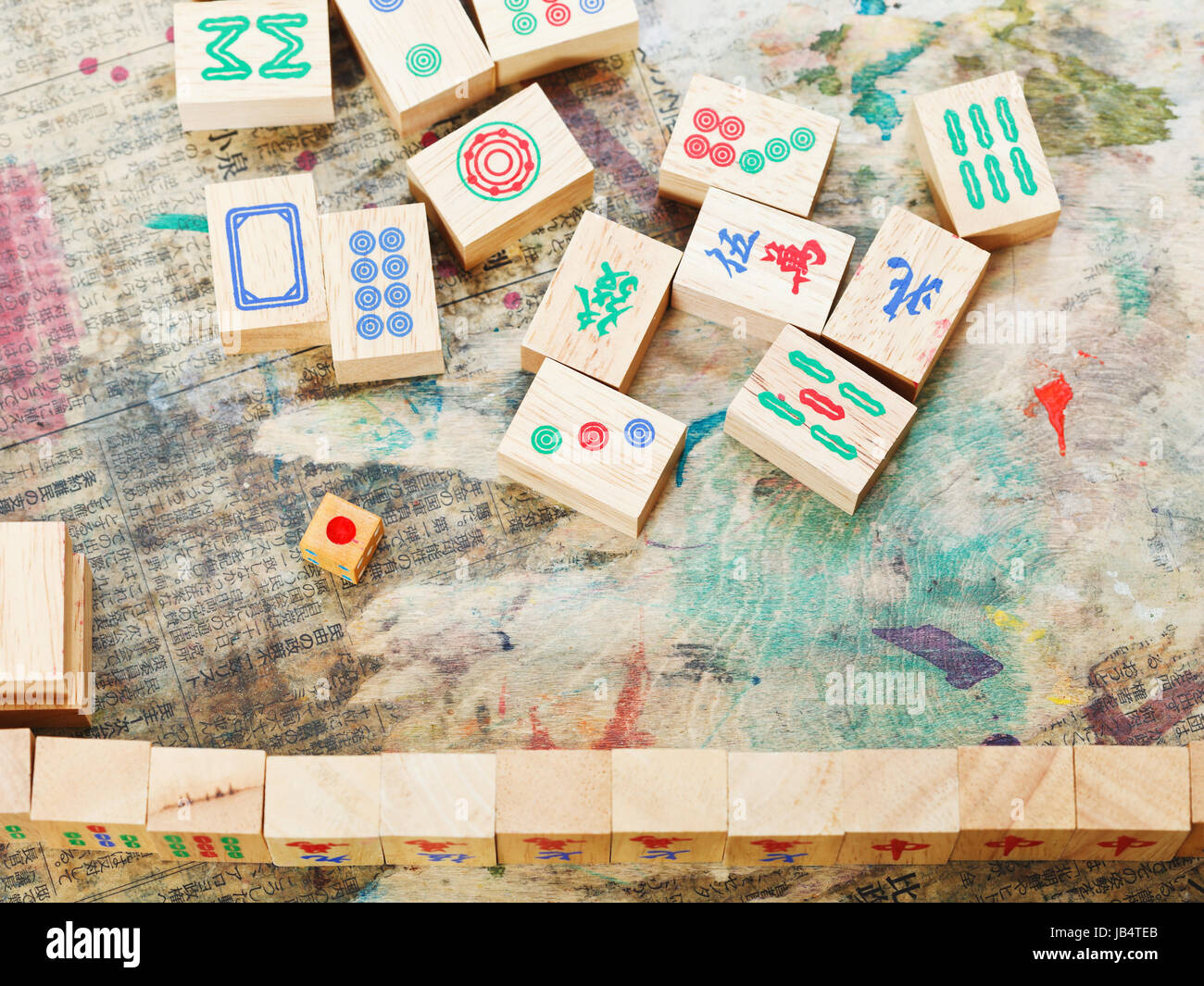playing in mahjong game by wood tiles on shabby table closeup Stock ...