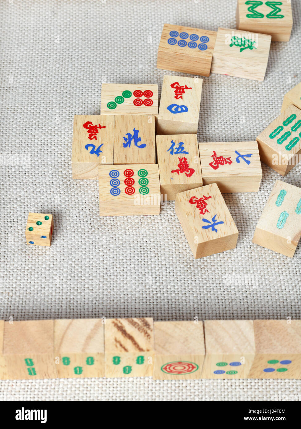 top view of wooden tiles of mahjong desk game on textile table Stock ...