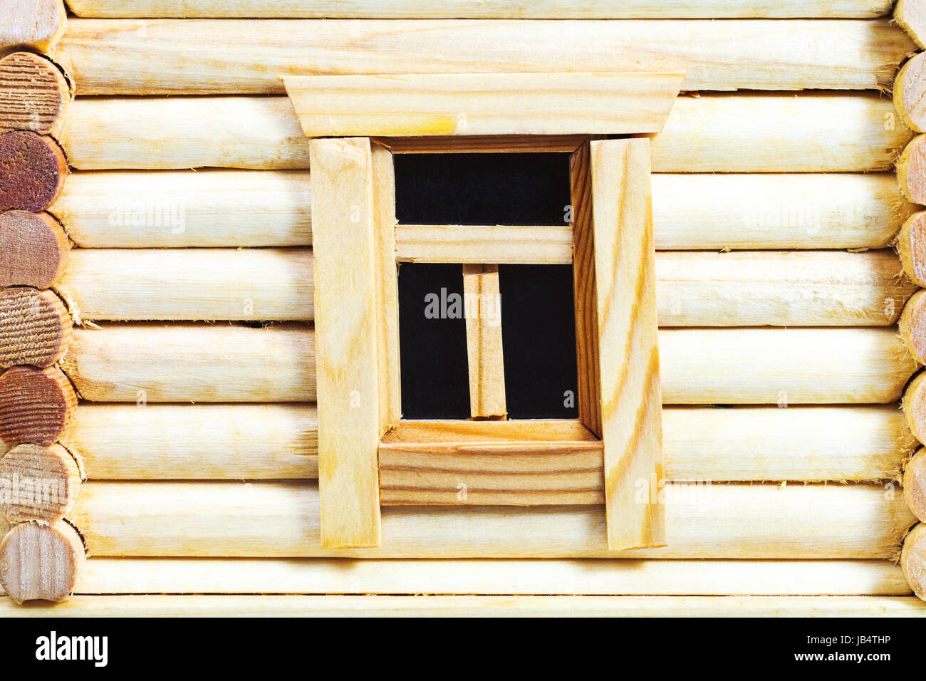 wall with window of model of simple village wooden log house isolated ...