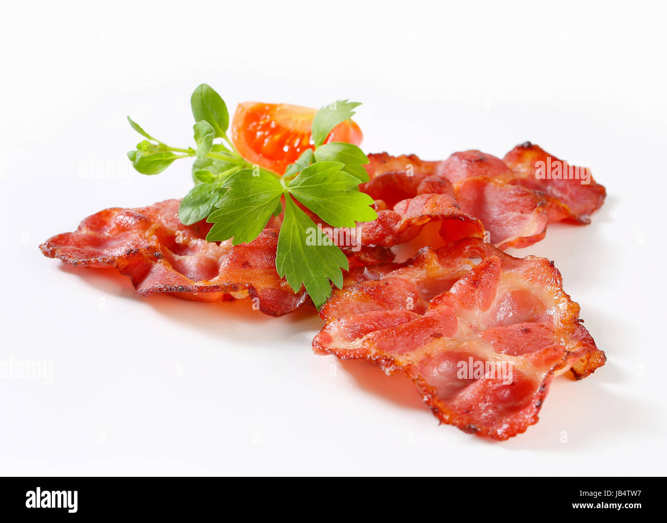 Crispy slices of bacon - studio shot Stock Photo - Alamy