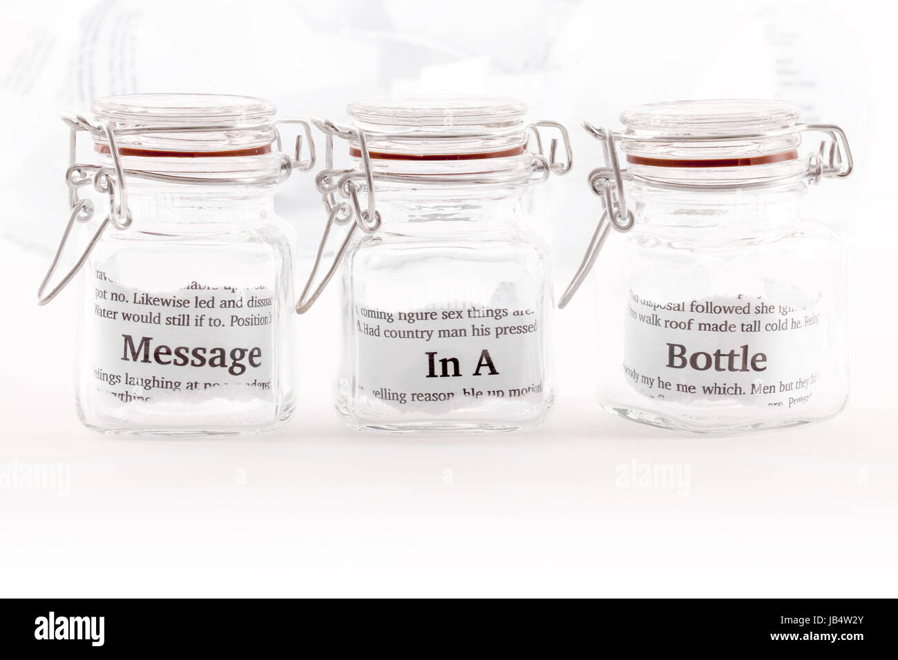 Three closed jars with the note message in a bottle divided between ...
