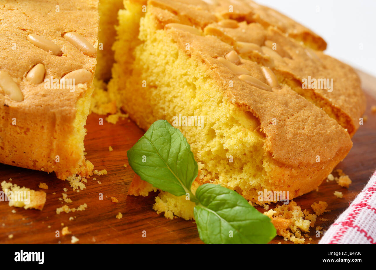 Slices of butter sponge cake on a cutting board Stock Photo - Alamy