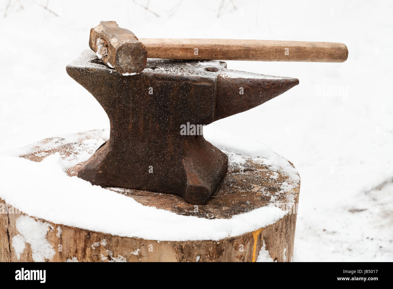 anvil with hammer in old abandoned village smithy in winter Stock Photo ...