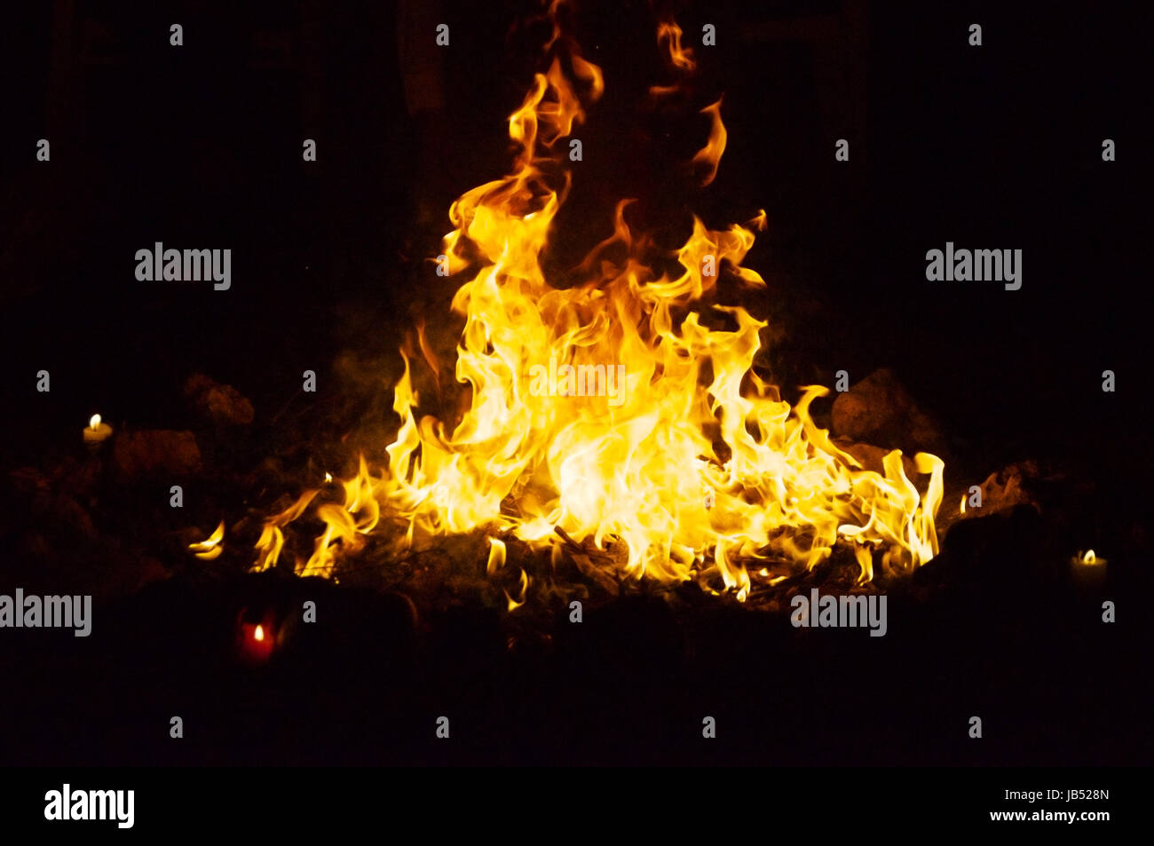 Flames and smoke fill this image of a ceremonial fire during a mayan ...