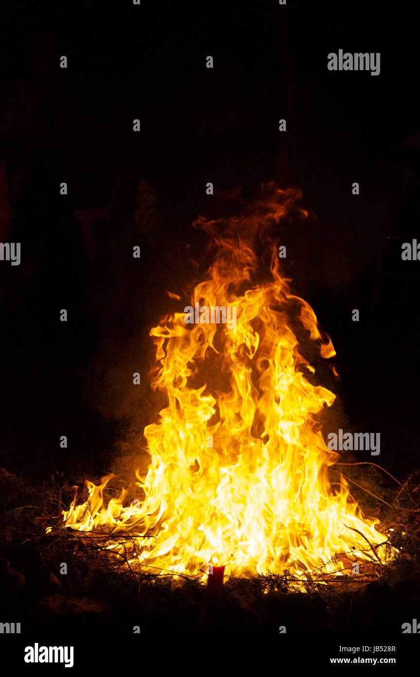 Flames and smoke fill this image of a ceremonial fire during a mayan ...