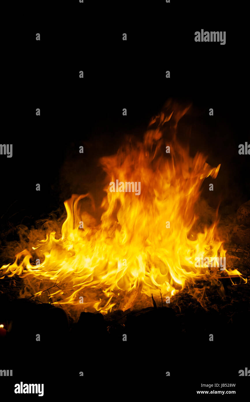 Flames and smoke fill this image of a ceremonial fire during a mayan ...