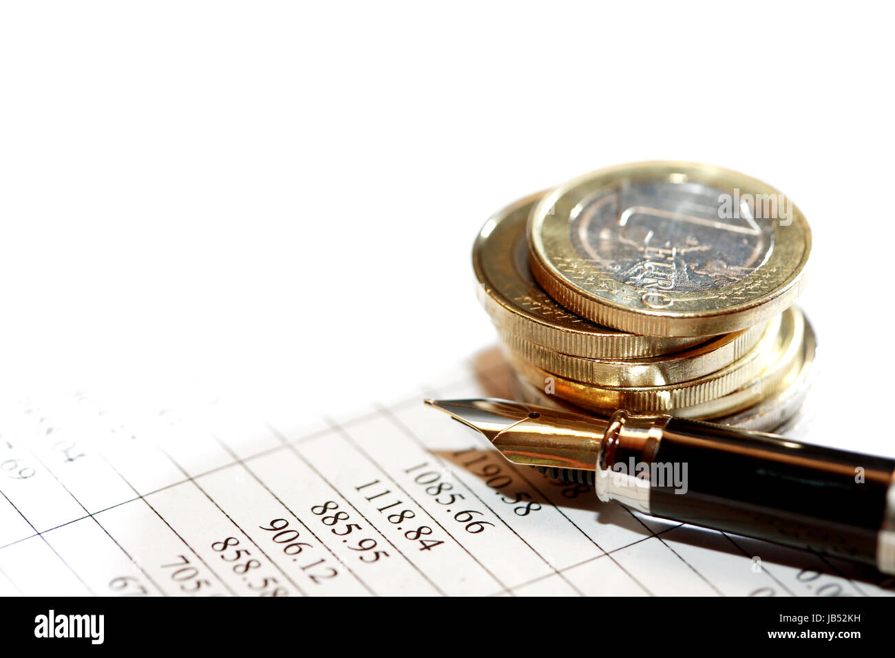 Closeup of coins stack on paper background with digits Stock Photo - Alamy