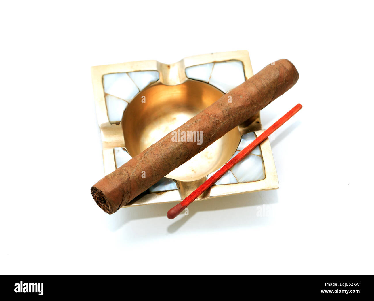 One Cuban cigar on vintage brass ashtray against white background Stock ...
