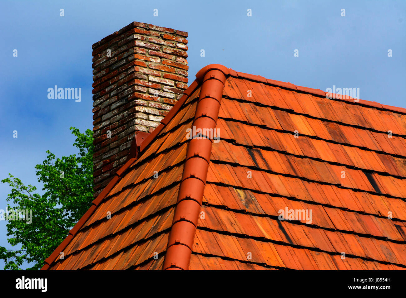 Unfinished house with a tiled roof in the village Stock Photo - Alamy