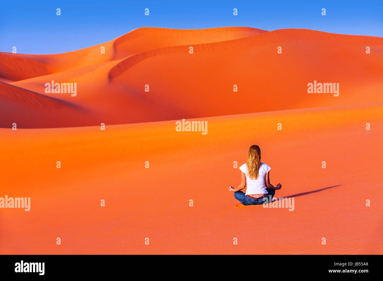 Meditation in desert, healthy active lifestyle, young female sitting ...