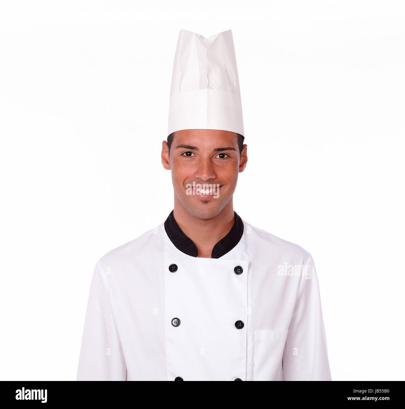 Portrait of professional 20s handsome chef on white uniform smiling at ...