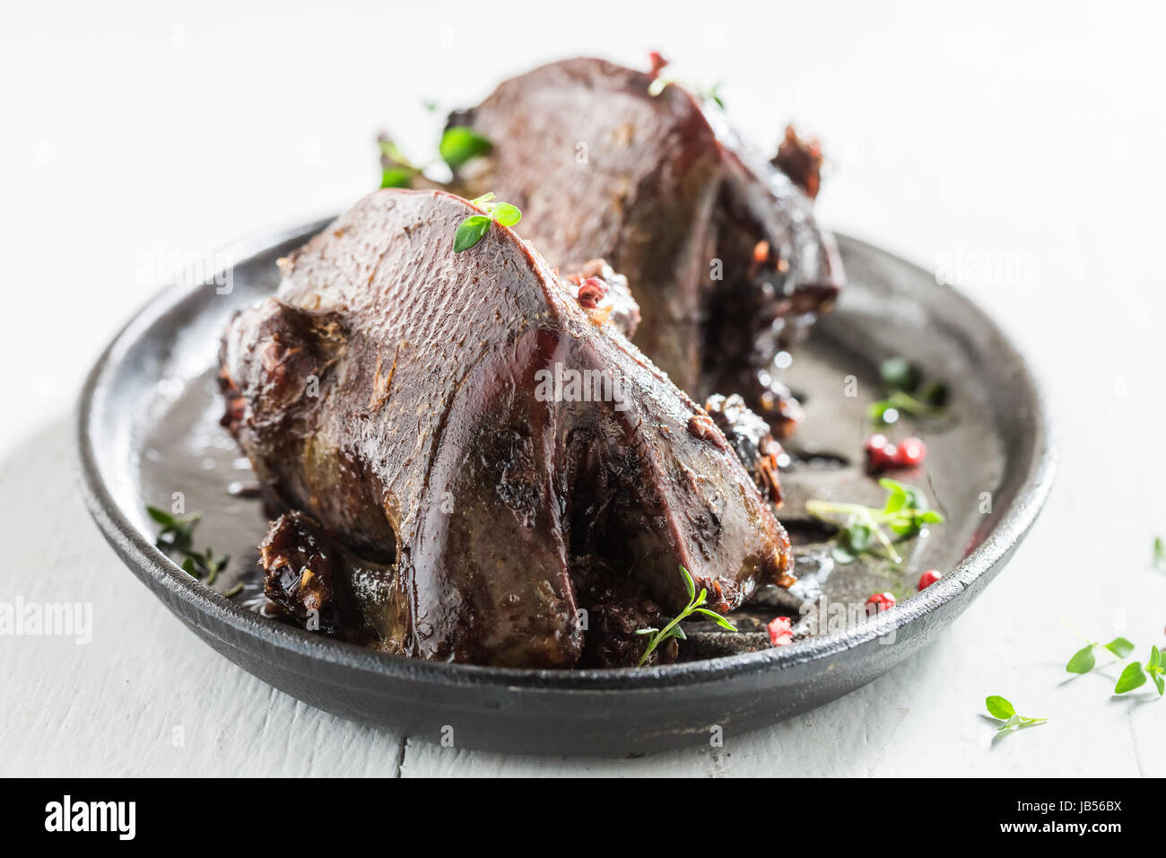 Roasted doves with spices and pepper on white background Stock Photo ...