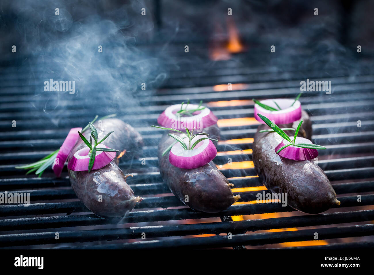 Black pudding with rosemary and onion on the grill Stock Photo - Alamy