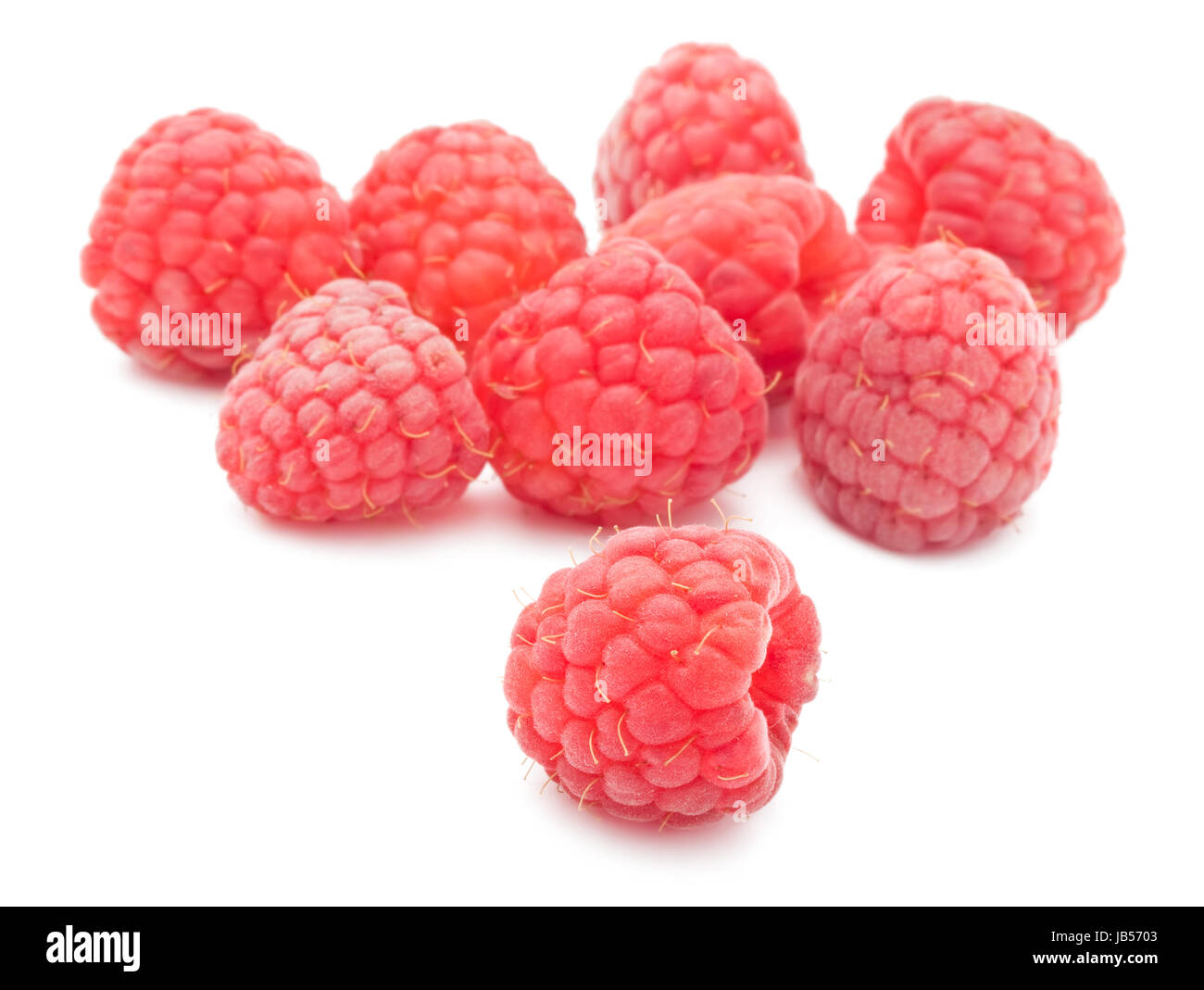 Ripe red raspberries isolated on white background Stock Photo - Alamy
