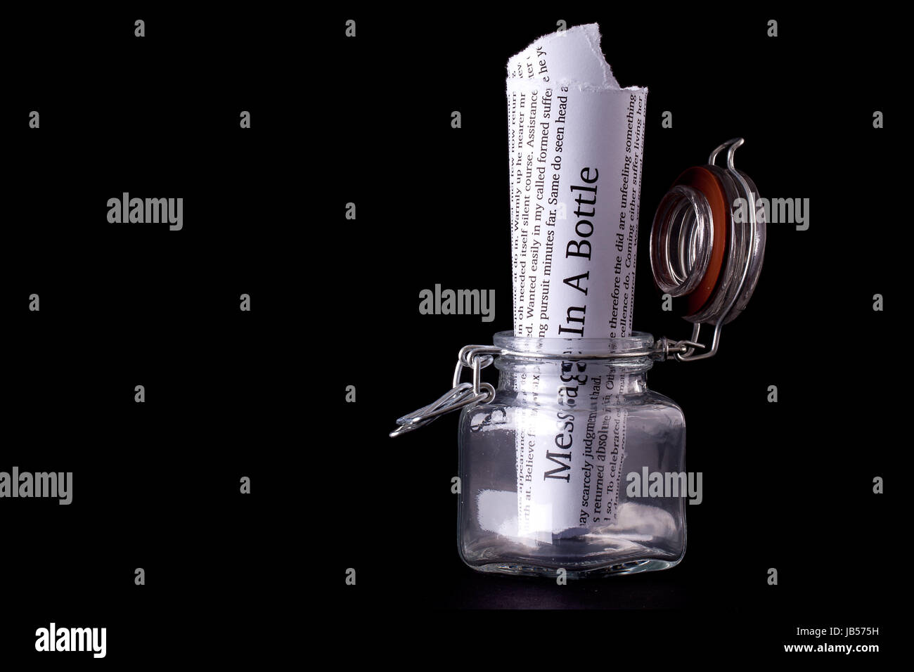 Message in a bottle paper note inside a glass jar with a black ...