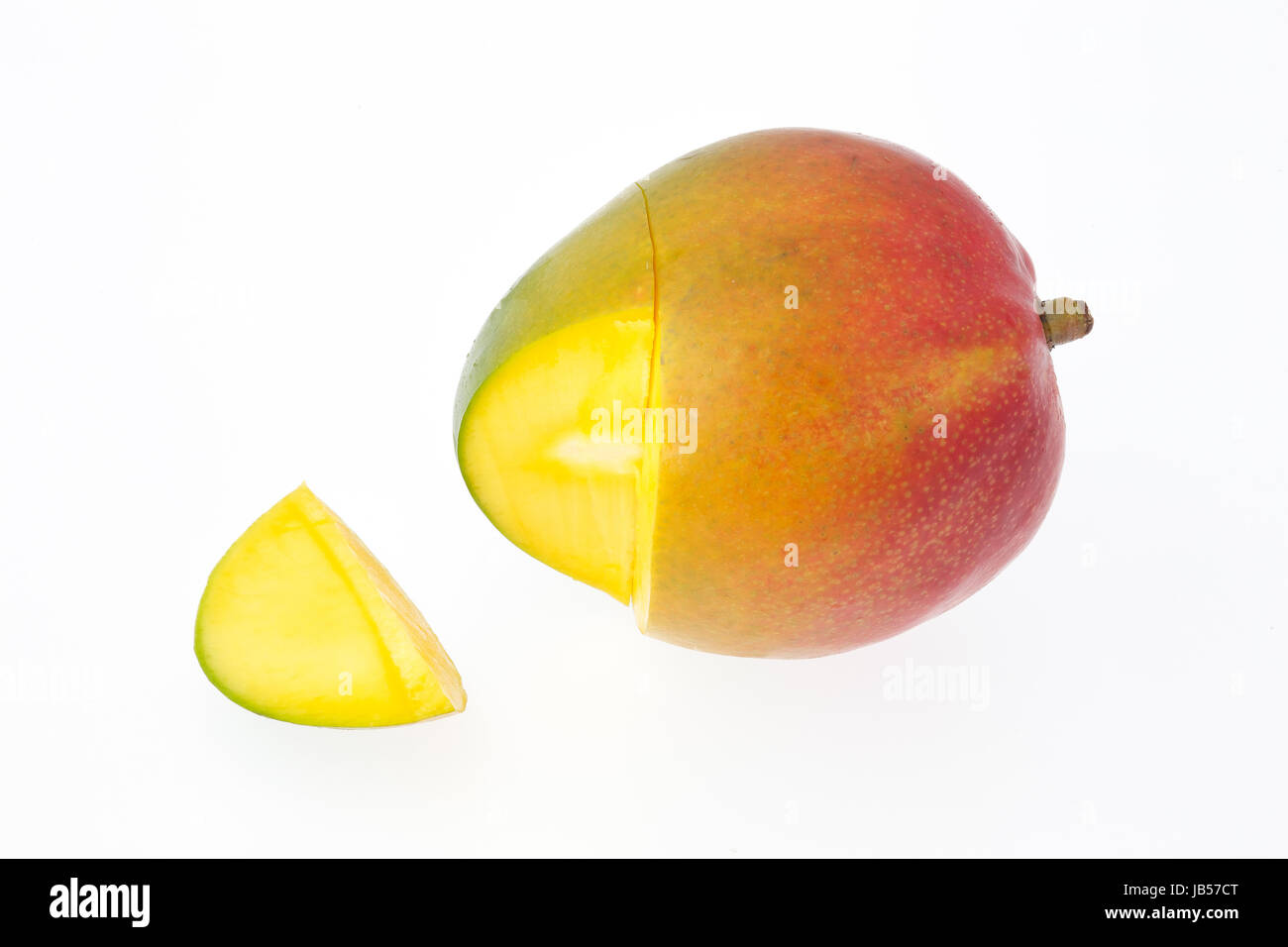 A whole ripe mango fruit with a small cut-out Stock Photo - Alamy