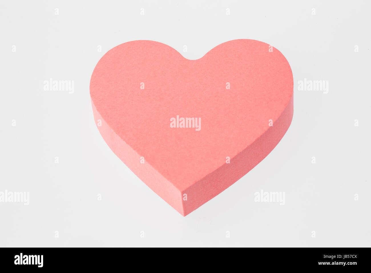 A block of heart-shaped paper notes on white background Stock Photo - Alamy