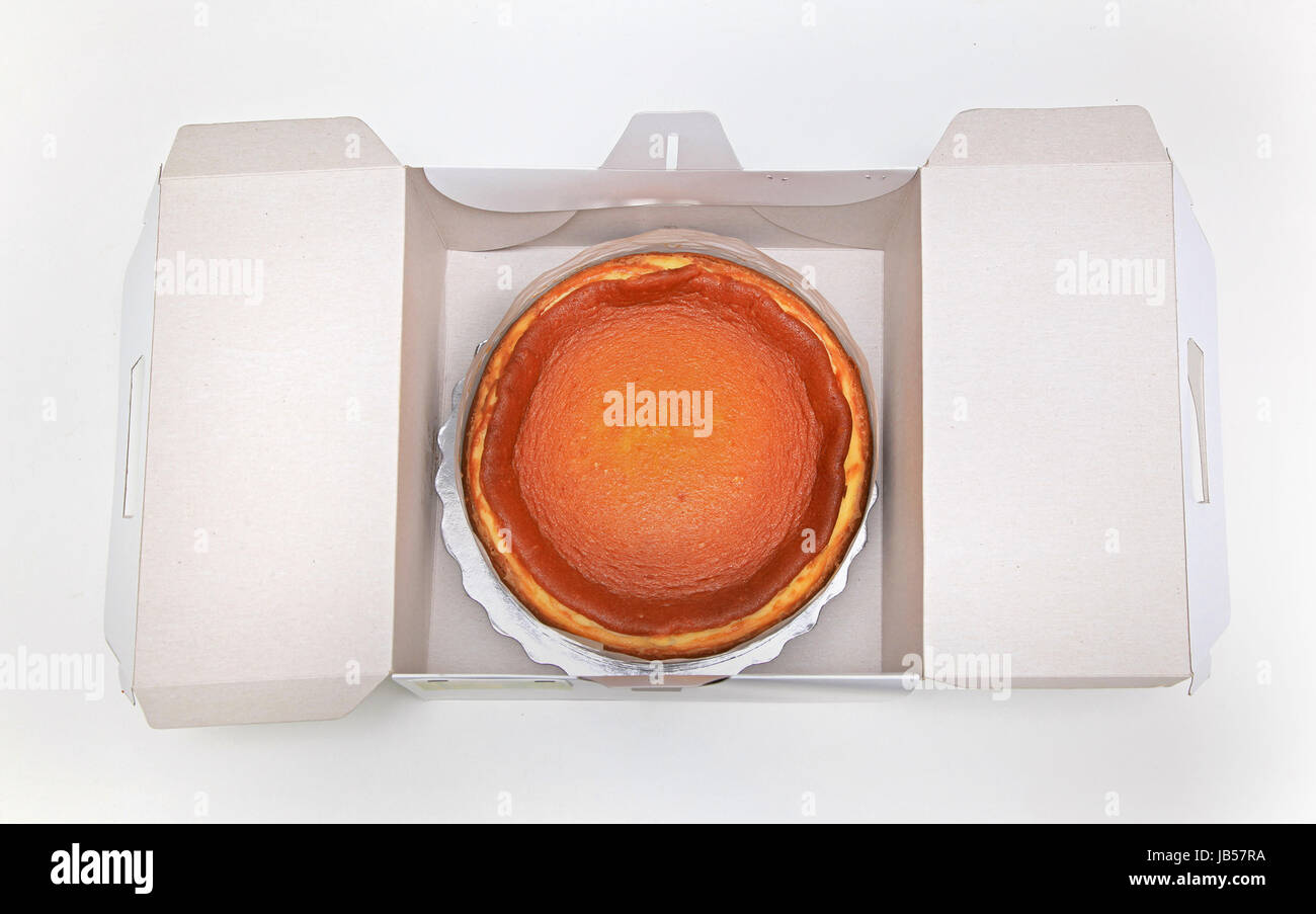 Baked cheese cake inside open cardboard box Stock Photo - Alamy