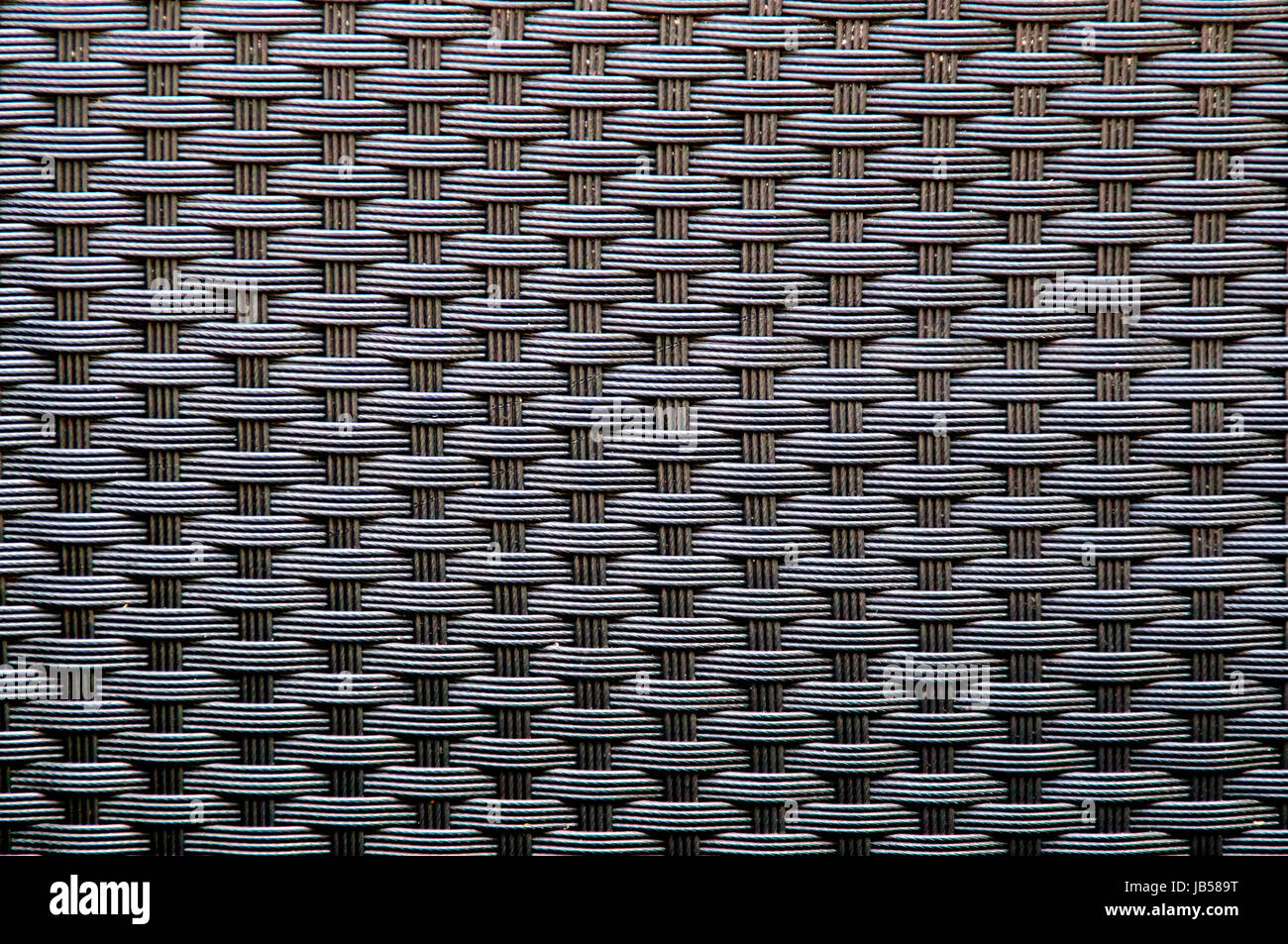 Full frame image of colored woven wicker creating optical illusion ...