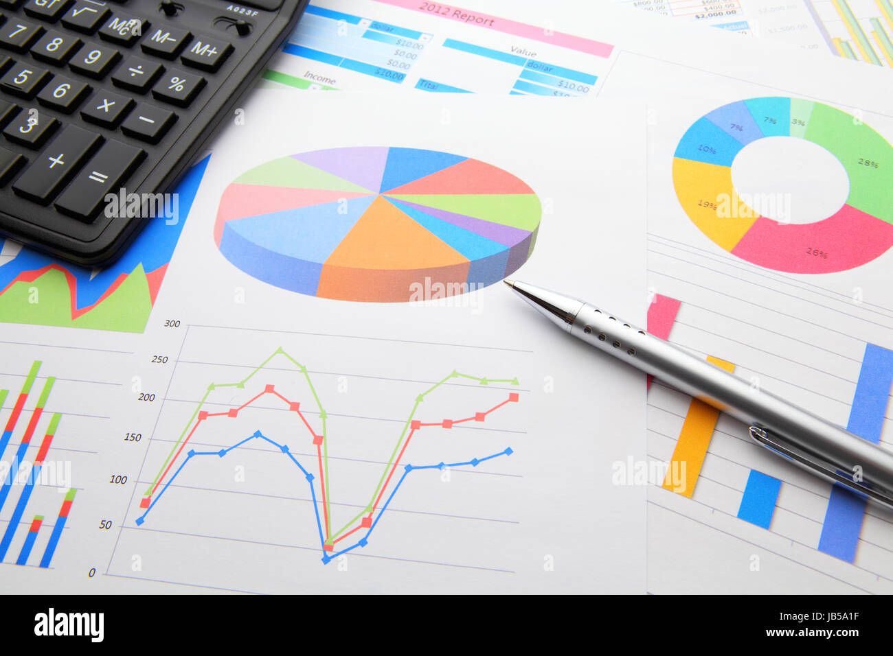 Data chart and calculator Stock Photo - Alamy