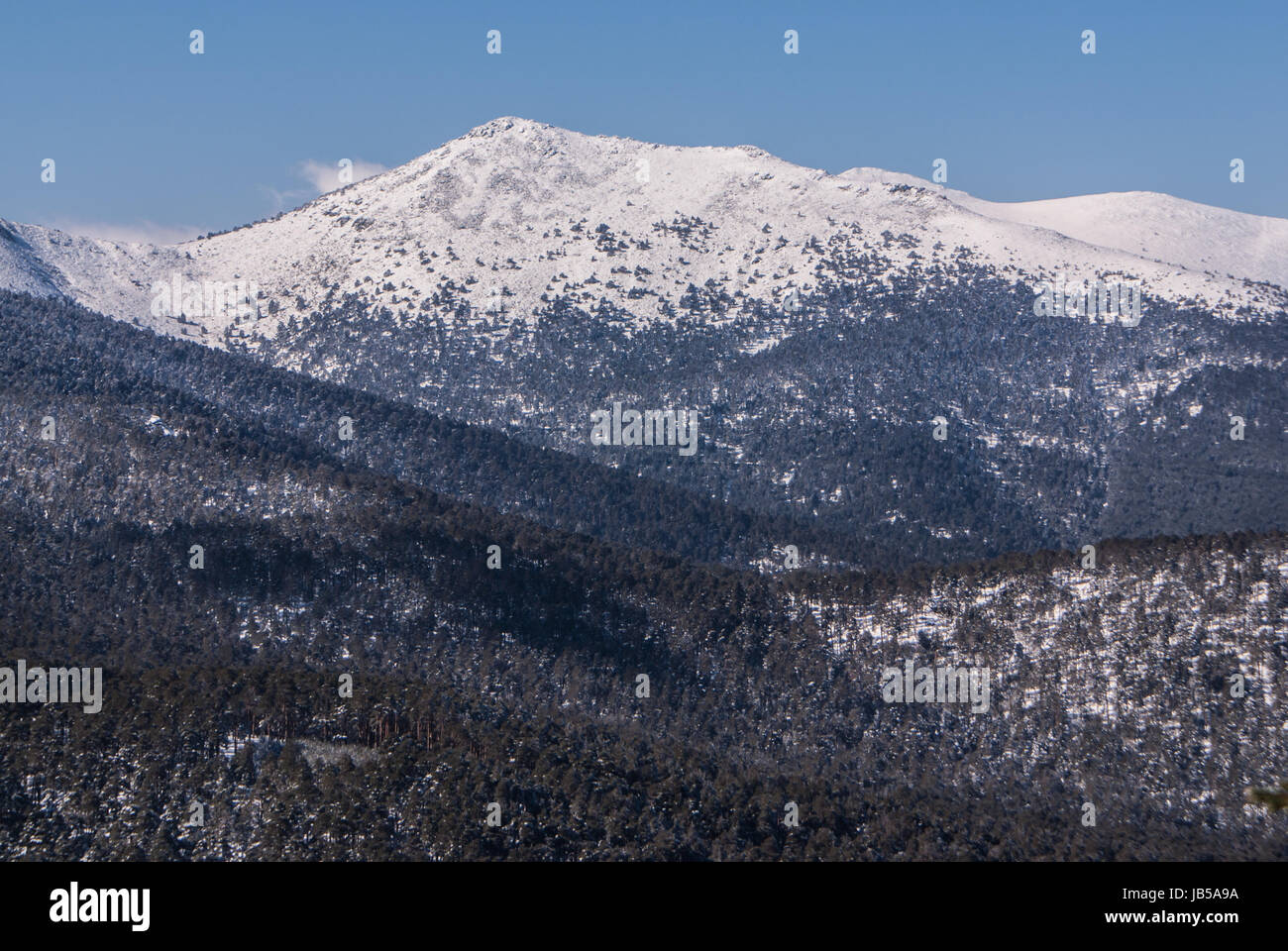 Snowy mountains and "bola del mundo" in Navacerrada, Madrid, Spain ...