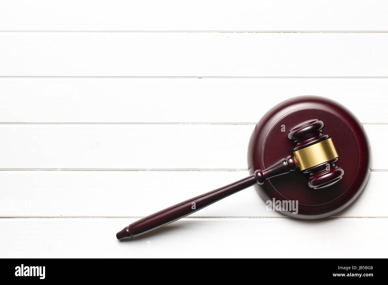 top view of wooden judge gavel on white wooden background Stock Photo ...