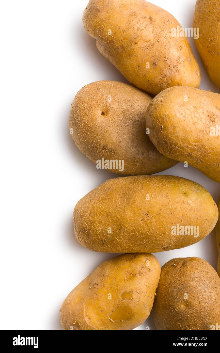 uncooked potatoes on white background Stock Photo - Alamy