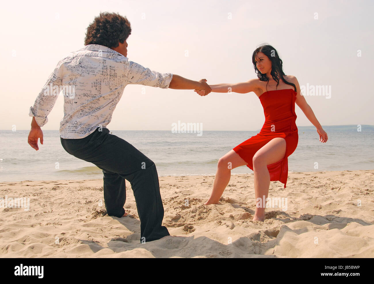 Two Dancers on the beach Stock Photo - Alamy