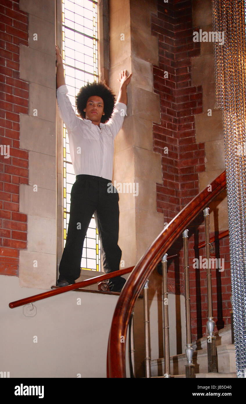 Young male dance on a window ledge on a staircase Stock Photo - Alamy