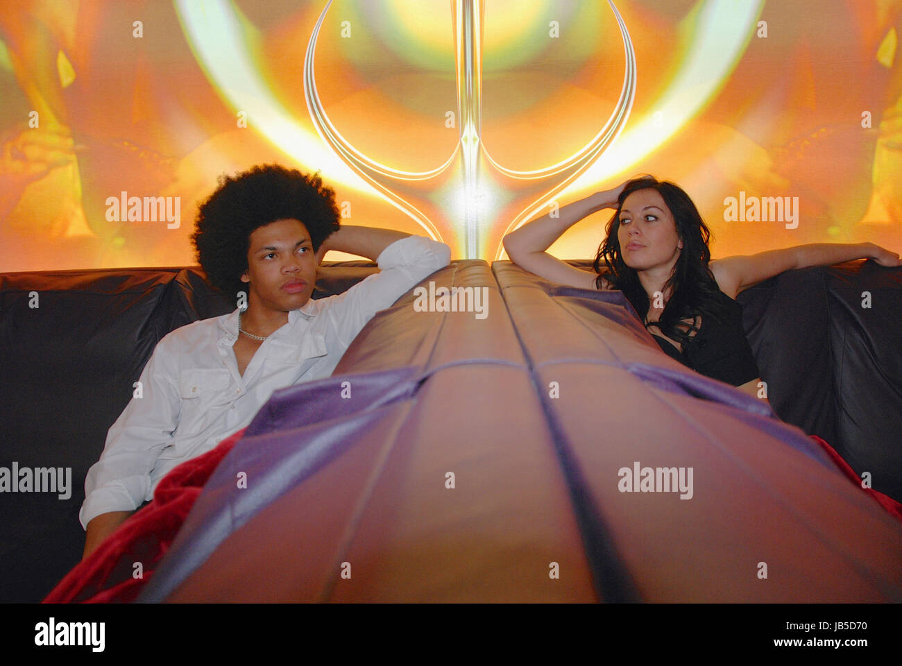 Two people inside a night club together Stock Photo - Alamy