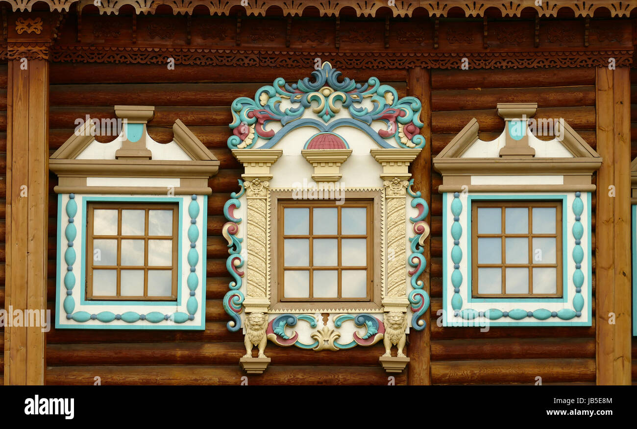 Russian carved wooden frames beautify exterior of timbered house Stock ...